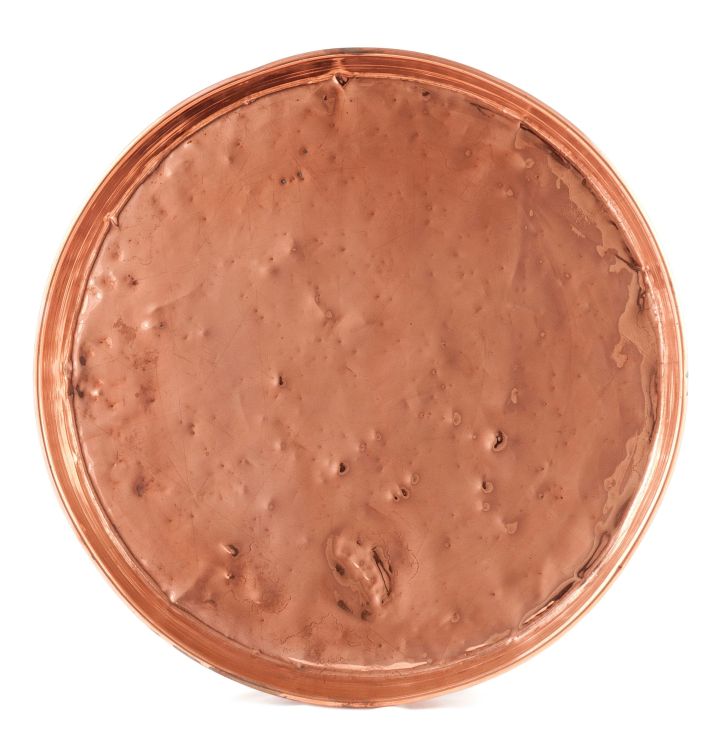 A large copper circular dish | Strauss & Co