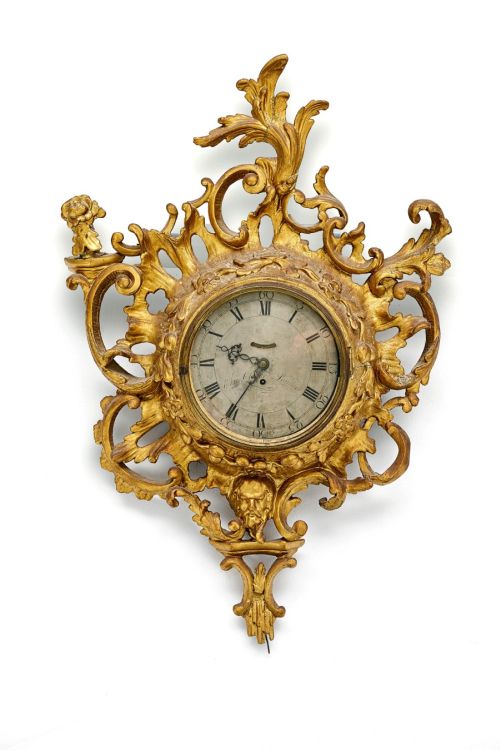 A George III giltwood cartel clock, Edward Clarke, London | Strauss & Co