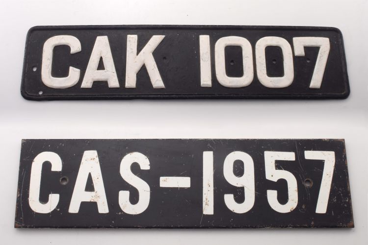 A black and white painted steel vehicle registration number plate CAK ...