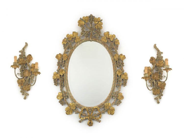 An Italian painted and gilt mirror and a pair of two-light wall sconces ...
