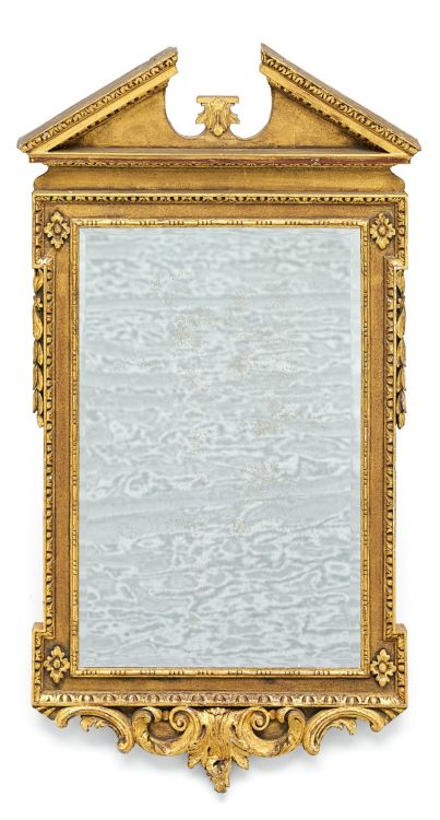 A George II style giltwood mirror | Strauss & Co